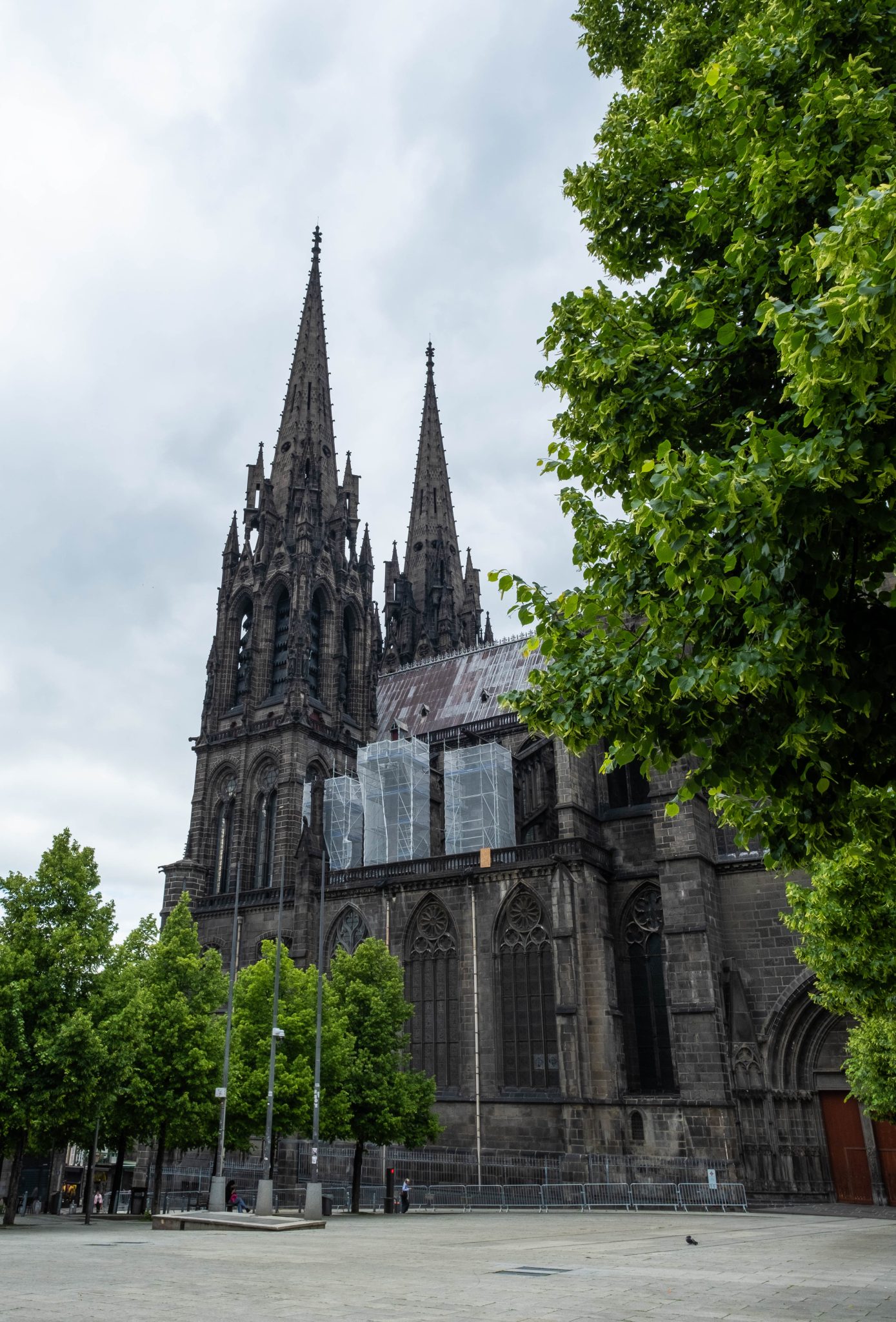 An ancient, dark landmark dominates the skyline of Clermont-Ferrand ...