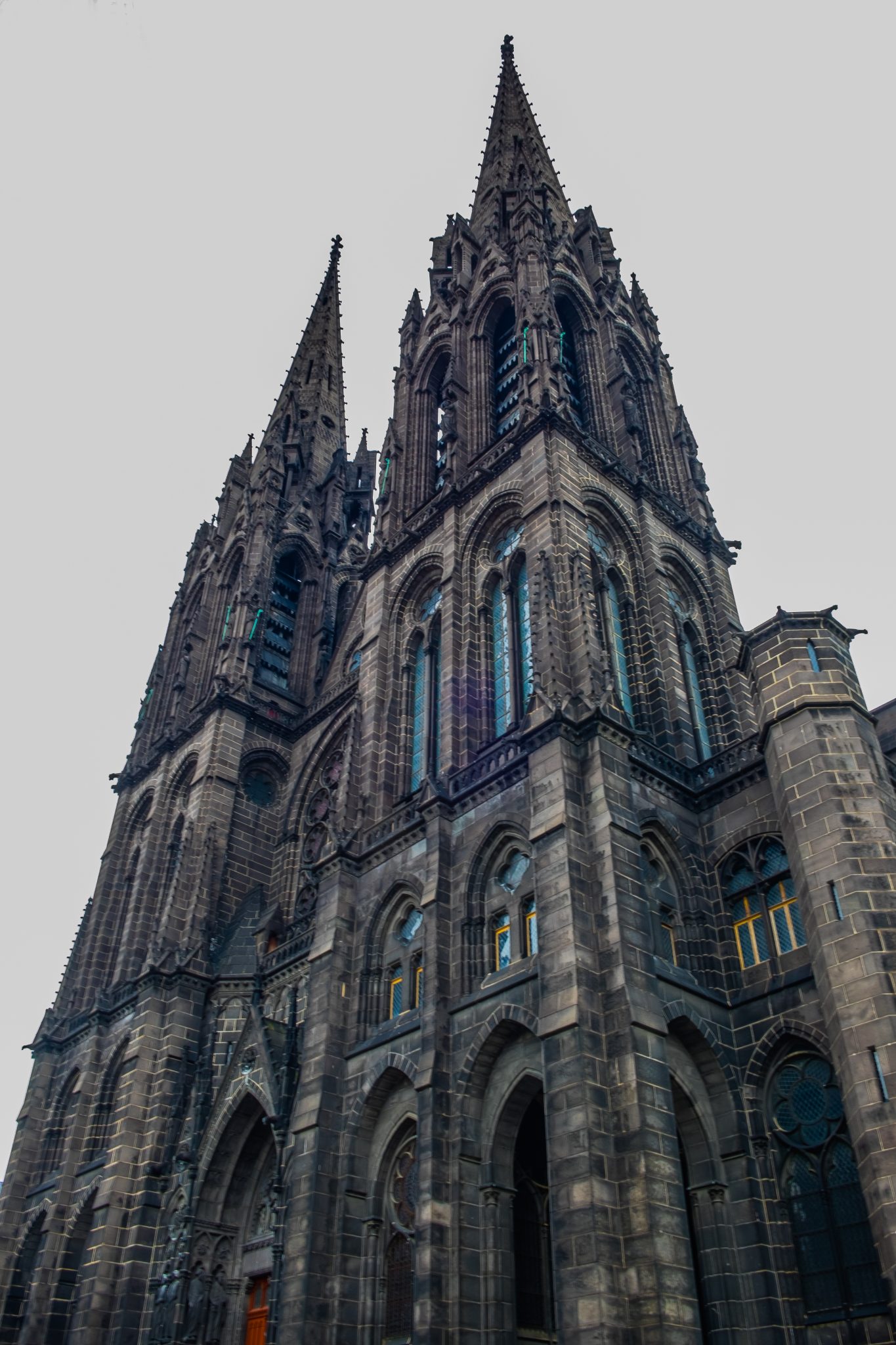 An ancient, dark landmark dominates the skyline of Clermont-Ferrand ...